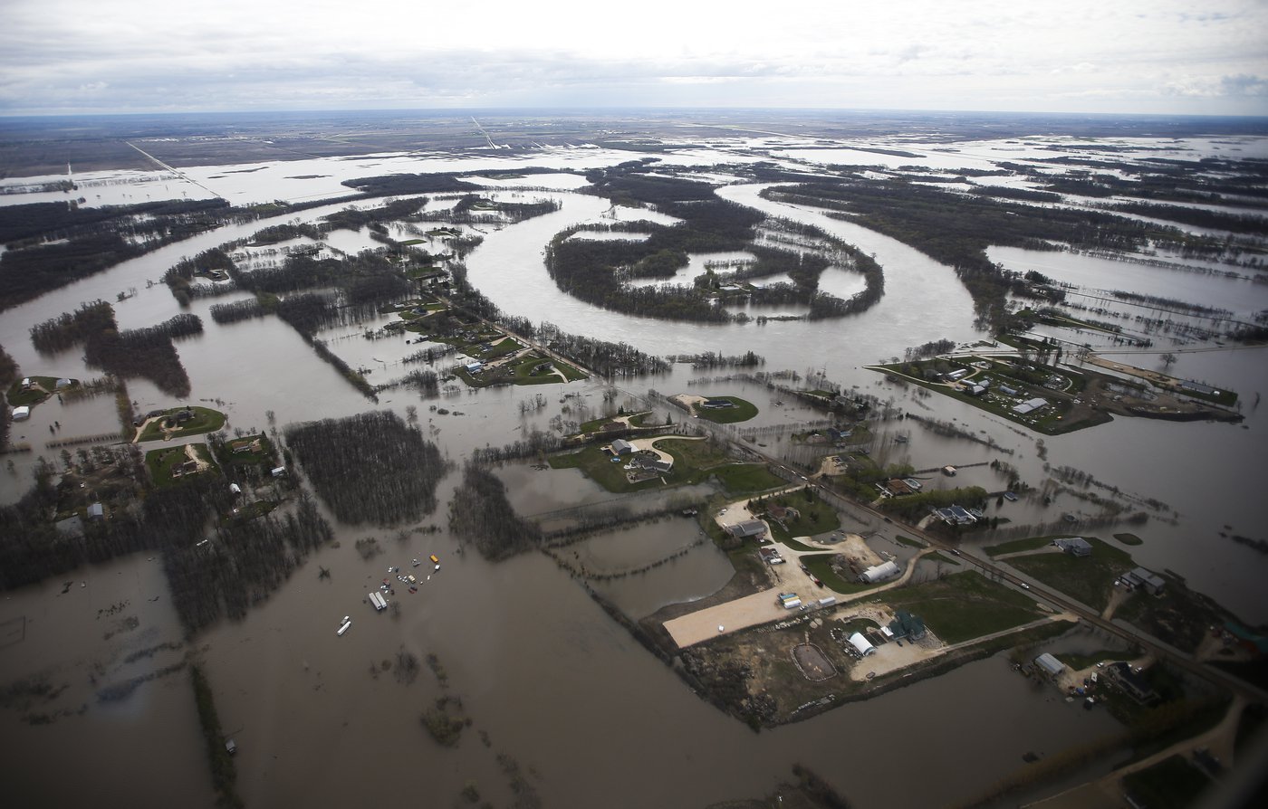 Manitoba premier tours flood zones by air, but more areas hit with ...