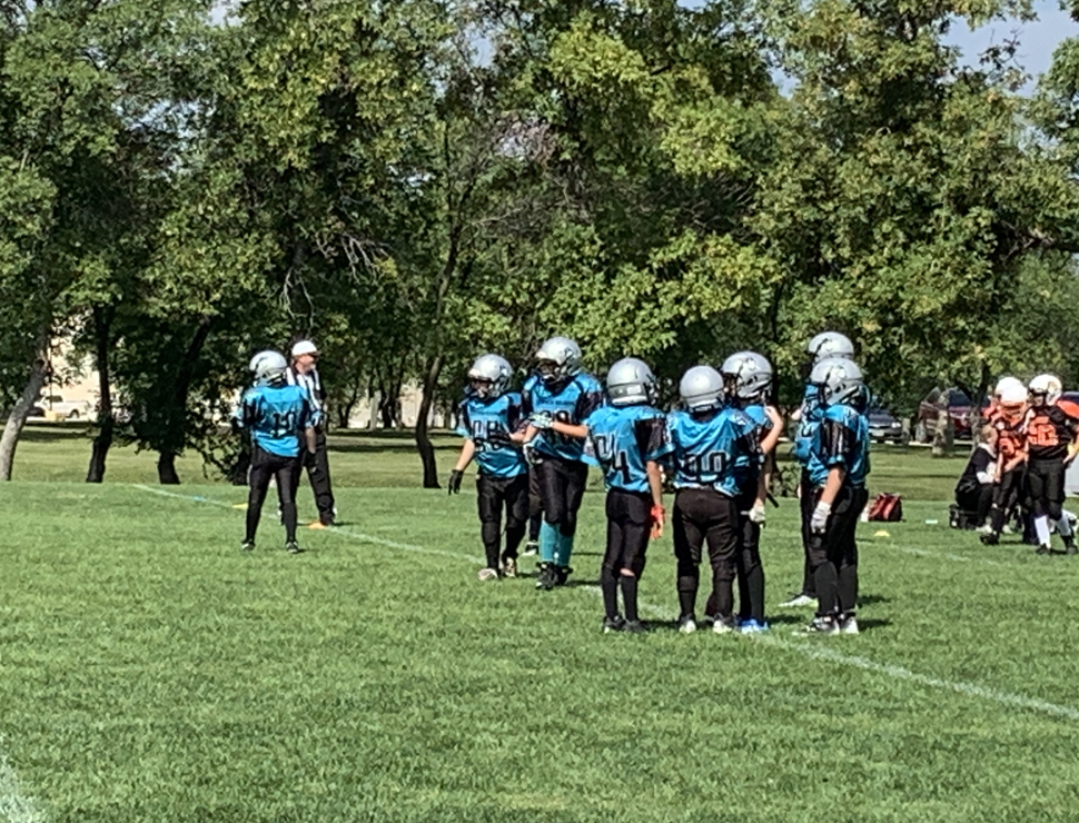 Football Moms proudly cheer on their kids during Eastman Raiders Days ...