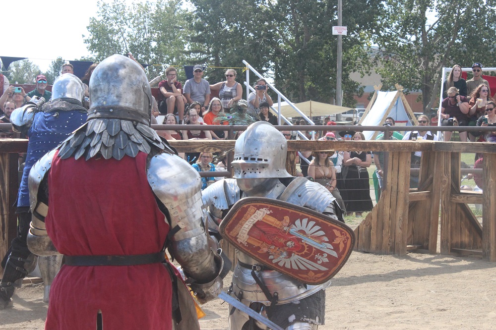 Swords smash shields during medieval combat demo at Strathmore Ag ...