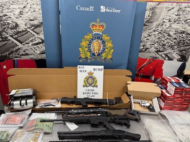 Cash and weapons seized in drug trafficking investigation, three ...