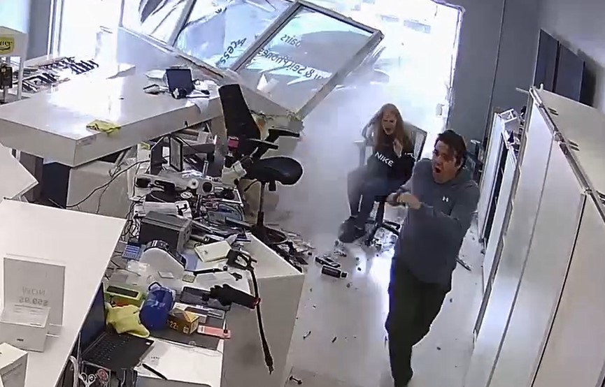 Video: Security footage captures moment a car plows through front of ...