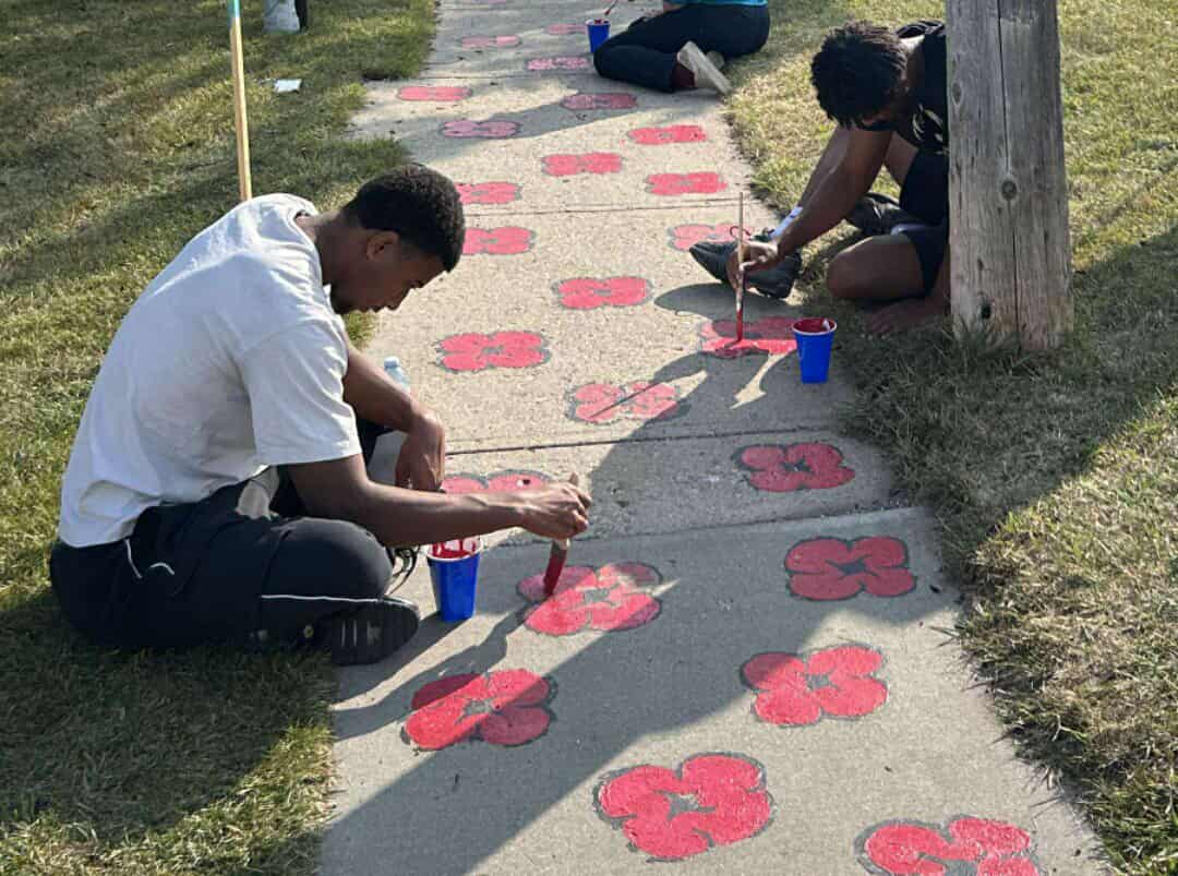 Volunteers paint sidewalks to beautify Airdrie Legion - DiscoverAirdrie ...