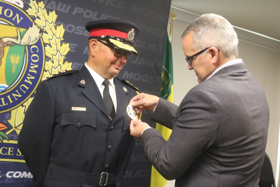 Robert Davis presented with Chief of Police badge - DiscoverMooseJaw ...