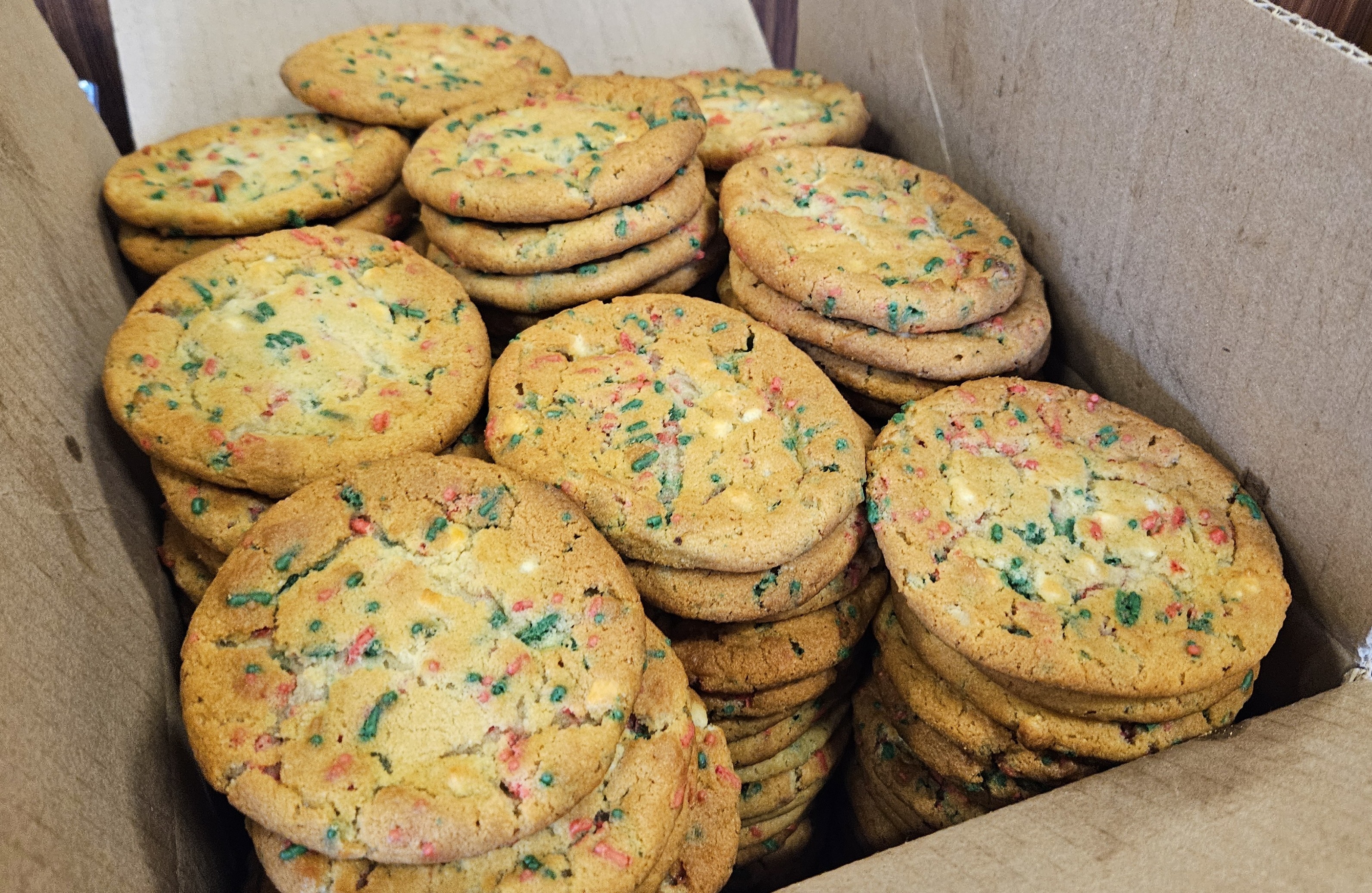 Council joins volunteers in massive Holiday Smile Cookie fundraiser ...