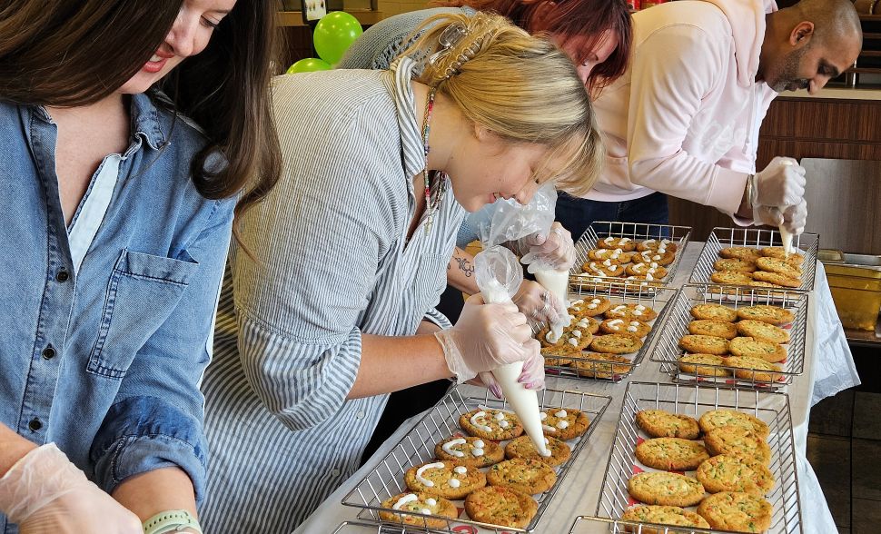 Council joins volunteers in massive Holiday Smile Cookie fundraiser ...