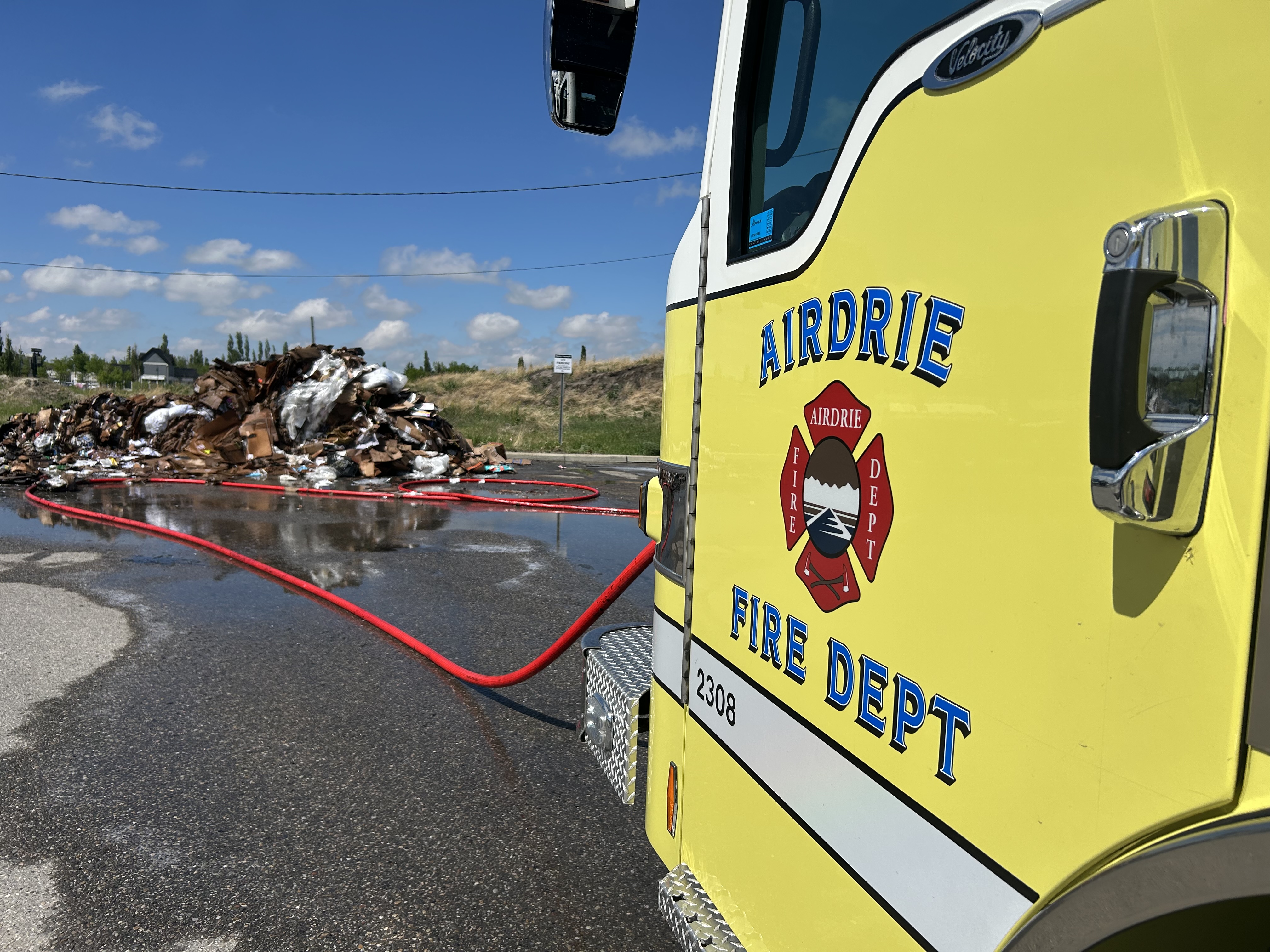 Airdrie fire crews extinguish recycling truck load fire ...
