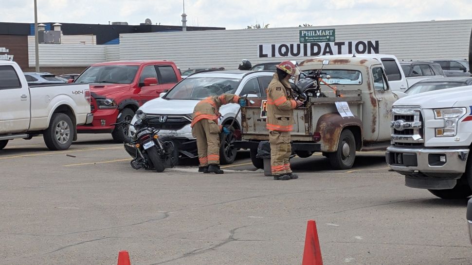 First responders attend scene of collision between motorbike, parked ...